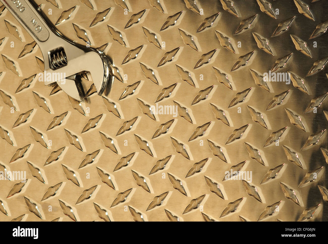 Tool or wrench on industrial diamond plate steel Stock Photo - Alamy