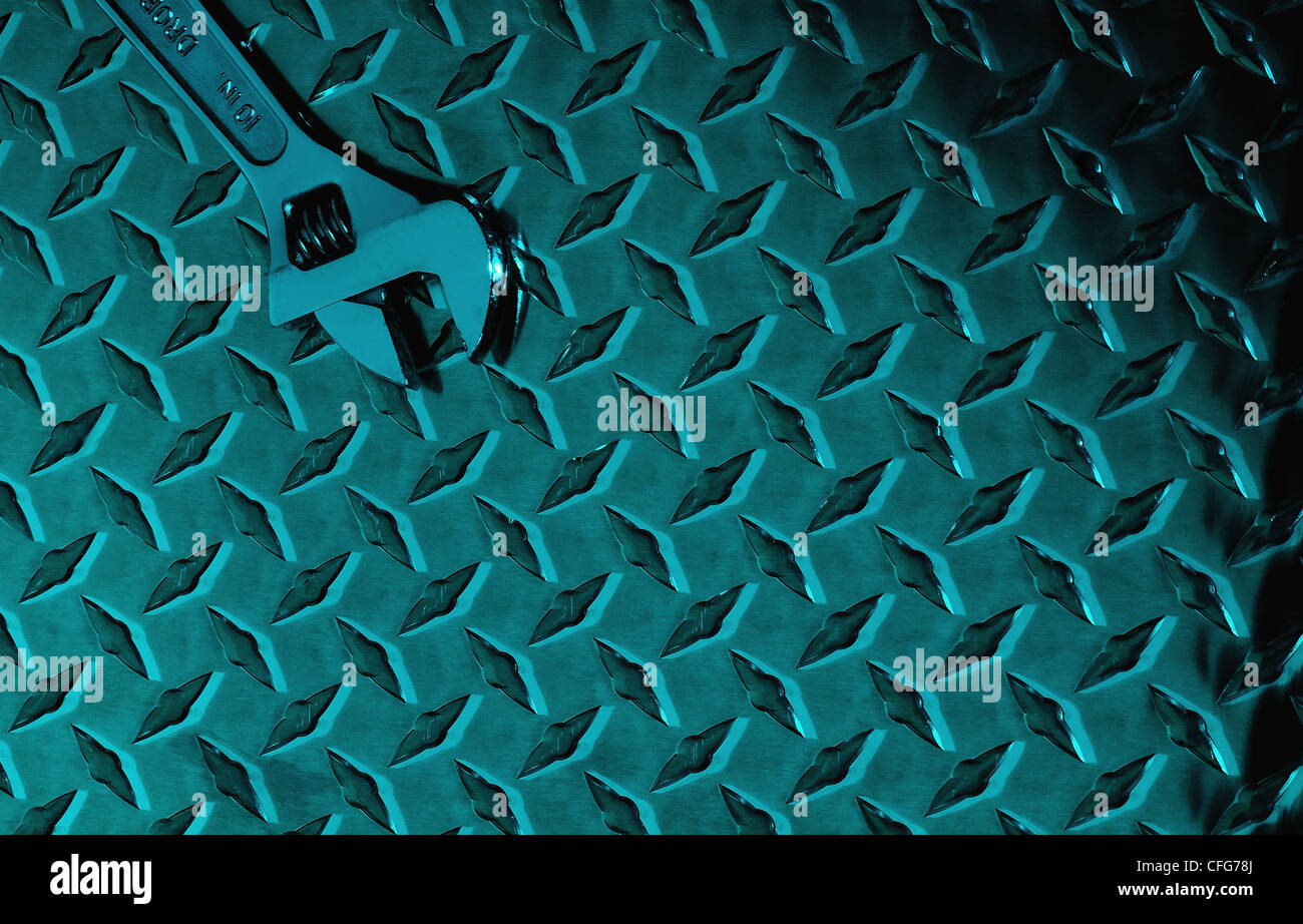 Tool or wrench on industrial diamond plate steel Stock Photo - Alamy
