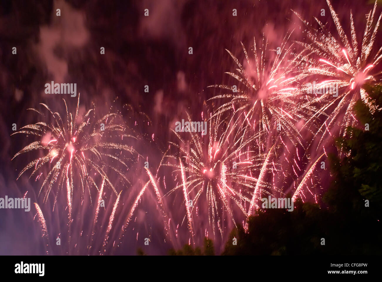 Colorful fireworks over dark sky, displayed during a celebration of ...