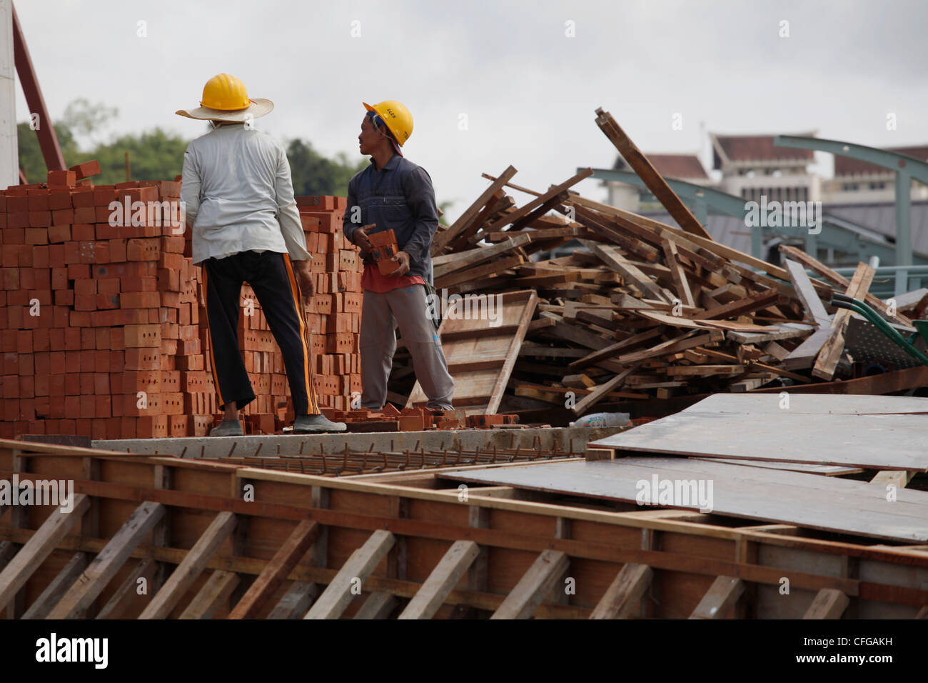 Immigrant workers from Bangladesh at a construction site in Bandar Seri ...