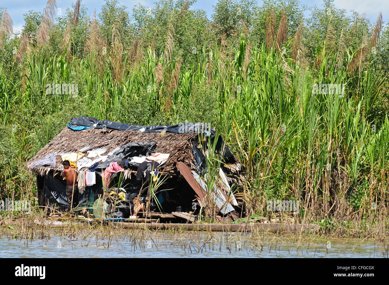 Poor people build floating wood huts on the flooded the Amazon River ...
