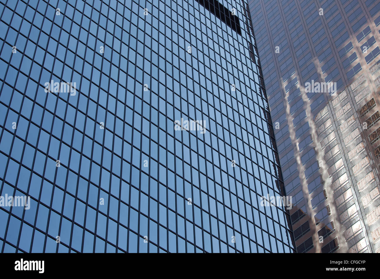 A tall windowed skyscraper with sky background Stock Photo - Alamy