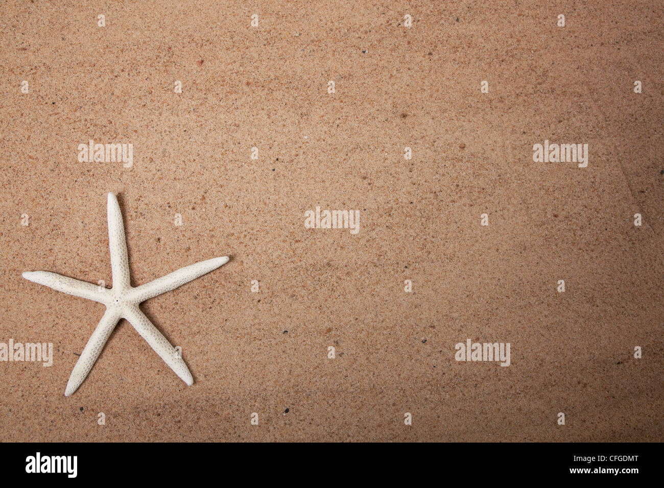 Sand background with a starfish Stock Photo - Alamy