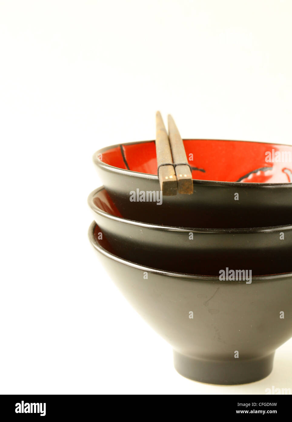 Asian cups and chopsticks on white background Stock Photo - Alamy