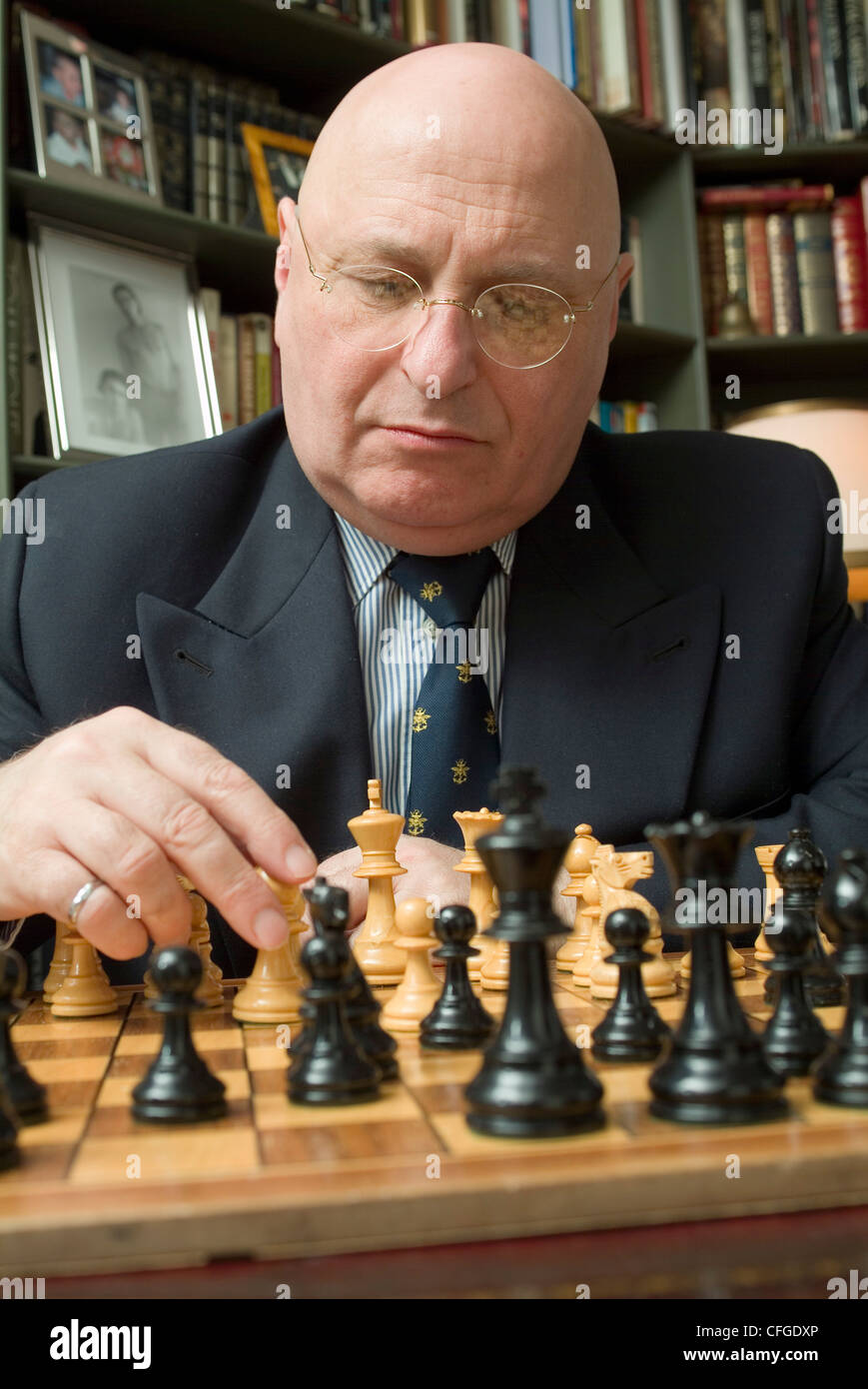 Man Playing Chess in Study Stock Photo - Alamy