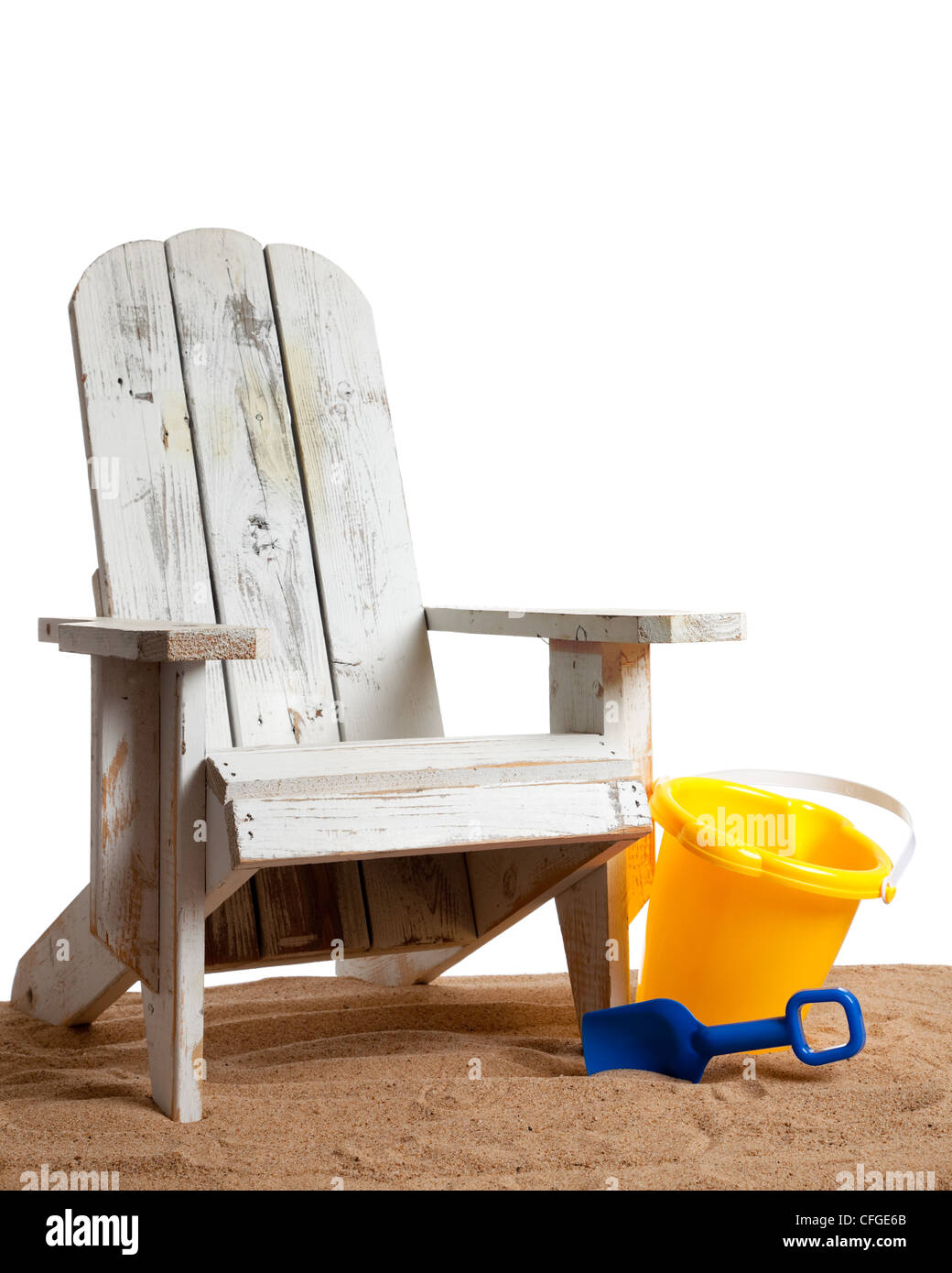 White Adirondack chair with shovel/pail with sand on white background ...