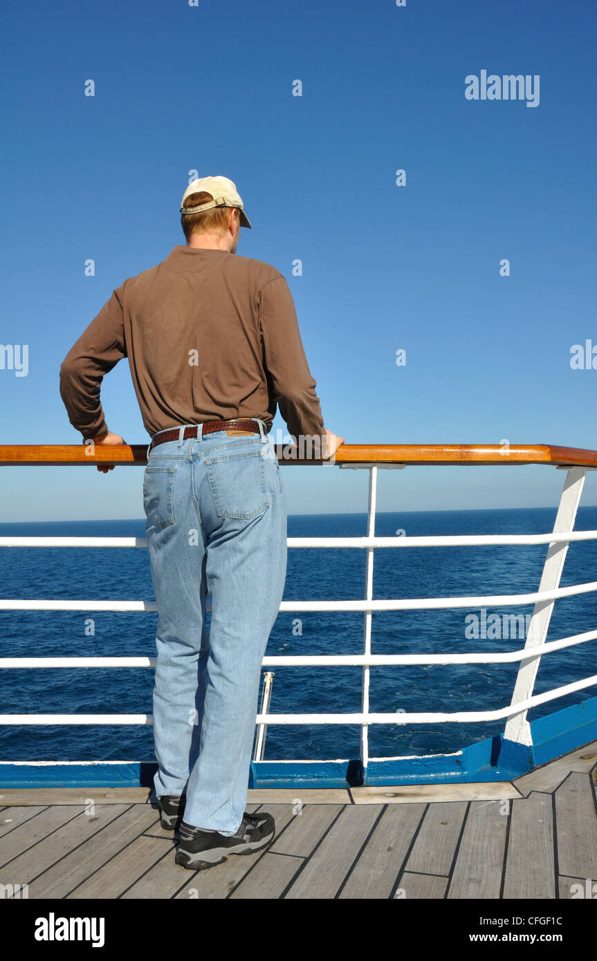 Man on cruise ship deck Stock Photo - Alamy