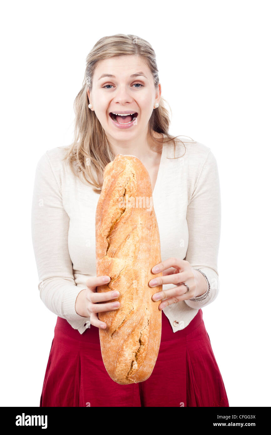 Happy young woman laughing and holding loaf of bread, isolated on white ...
