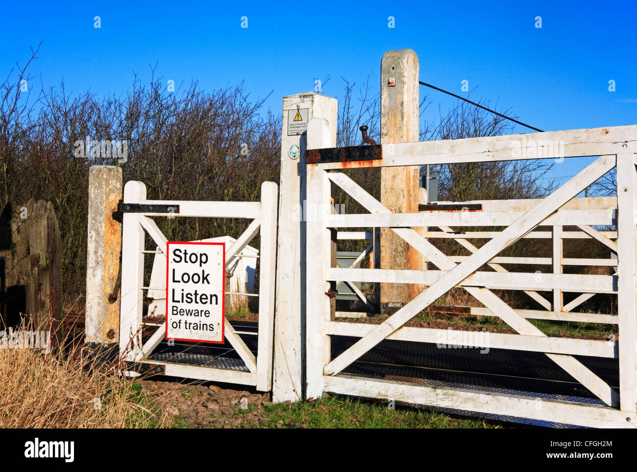 Rural level crossing gate on the Norwich to Great Yarmouth railwat line ...