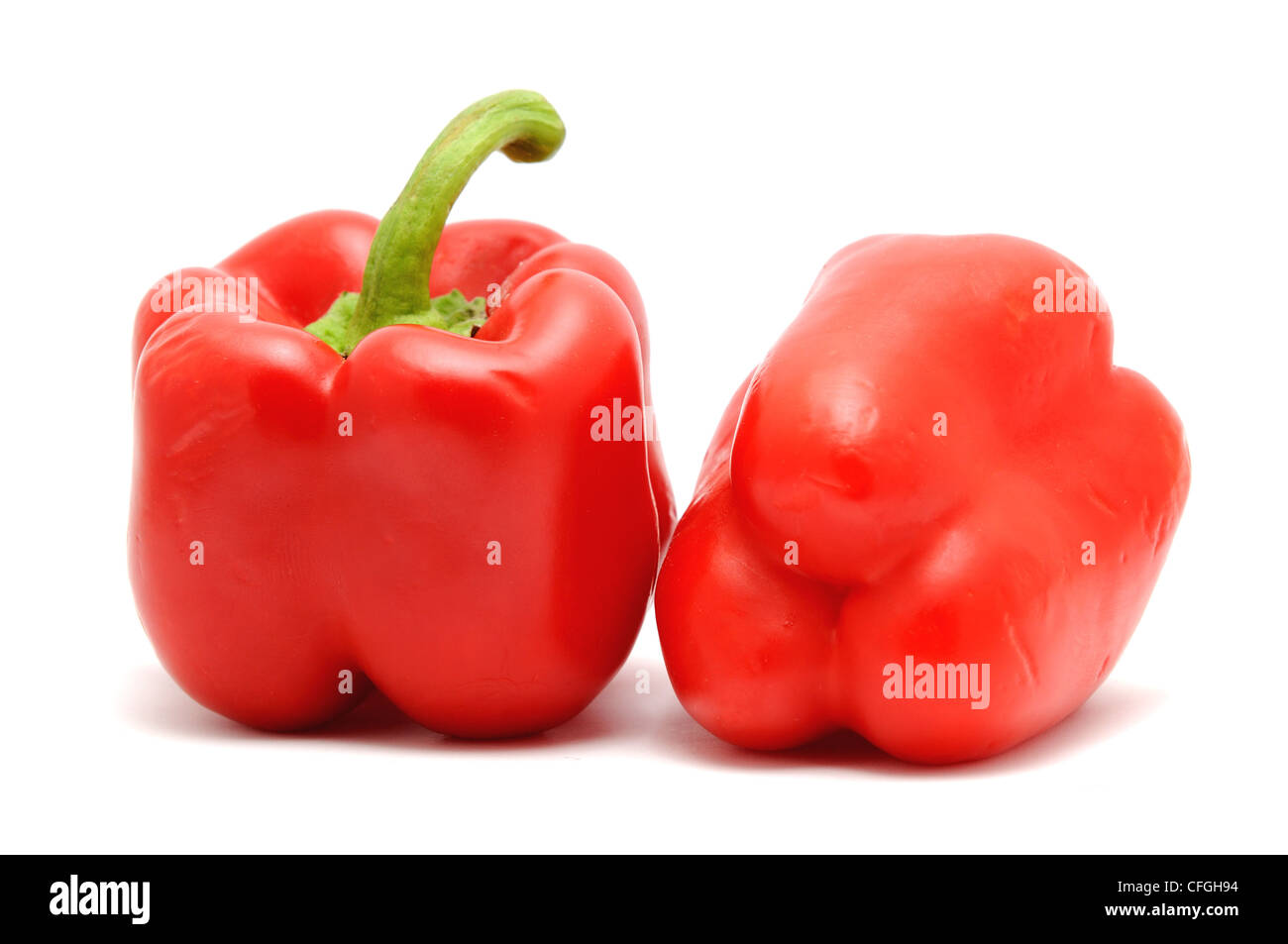 Two red peppers placed on the white background Stock Photo - Alamy