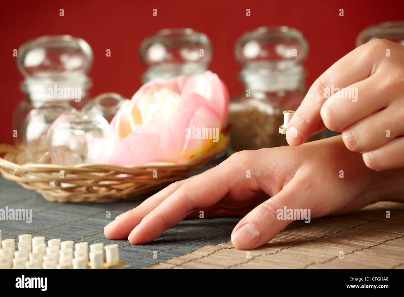 TCM Traditional Chinese Medicine. Hand applying mini moxa stick therapy ...