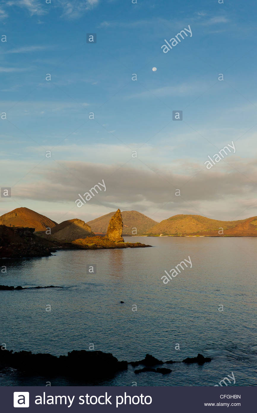 Moon rise over landscape of volcanic rock and water Stock Photo - Alamy