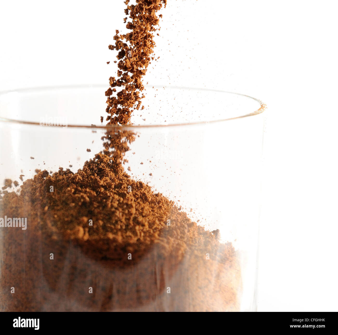 Closeup image of pouring brown instant coffee to the glass Stock Photo ...