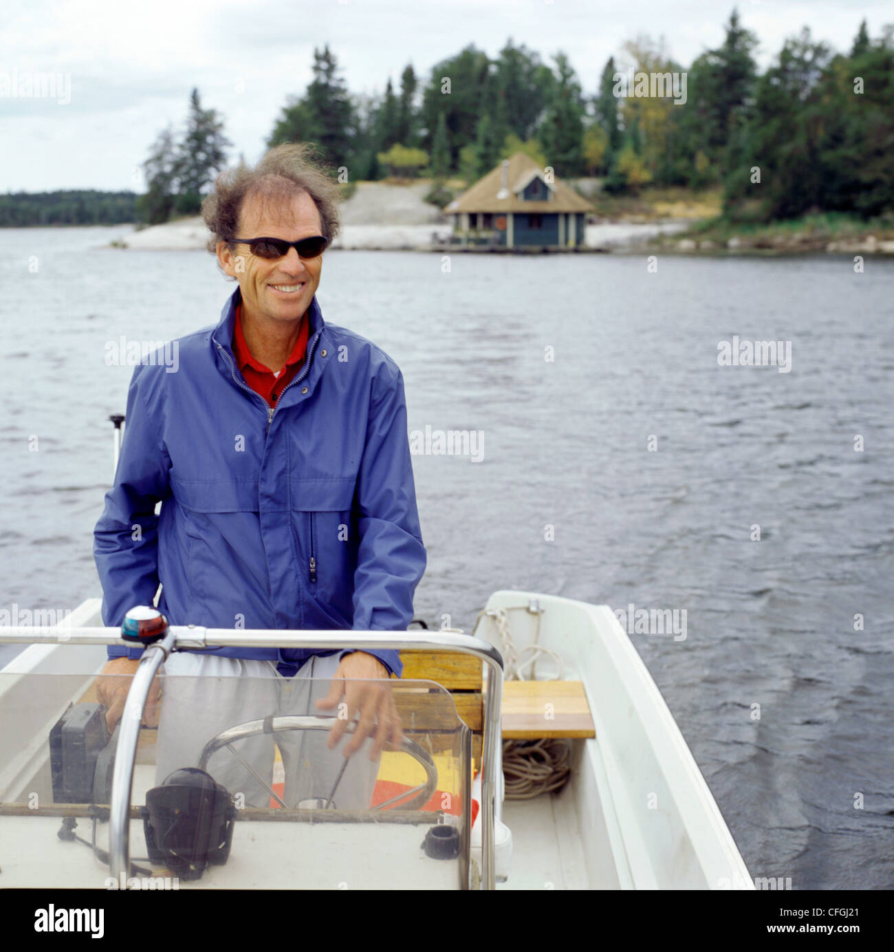 Man Driving Speed Boat, Gunn Lake, Minaki, Ontario Stock Photo - Alamy
