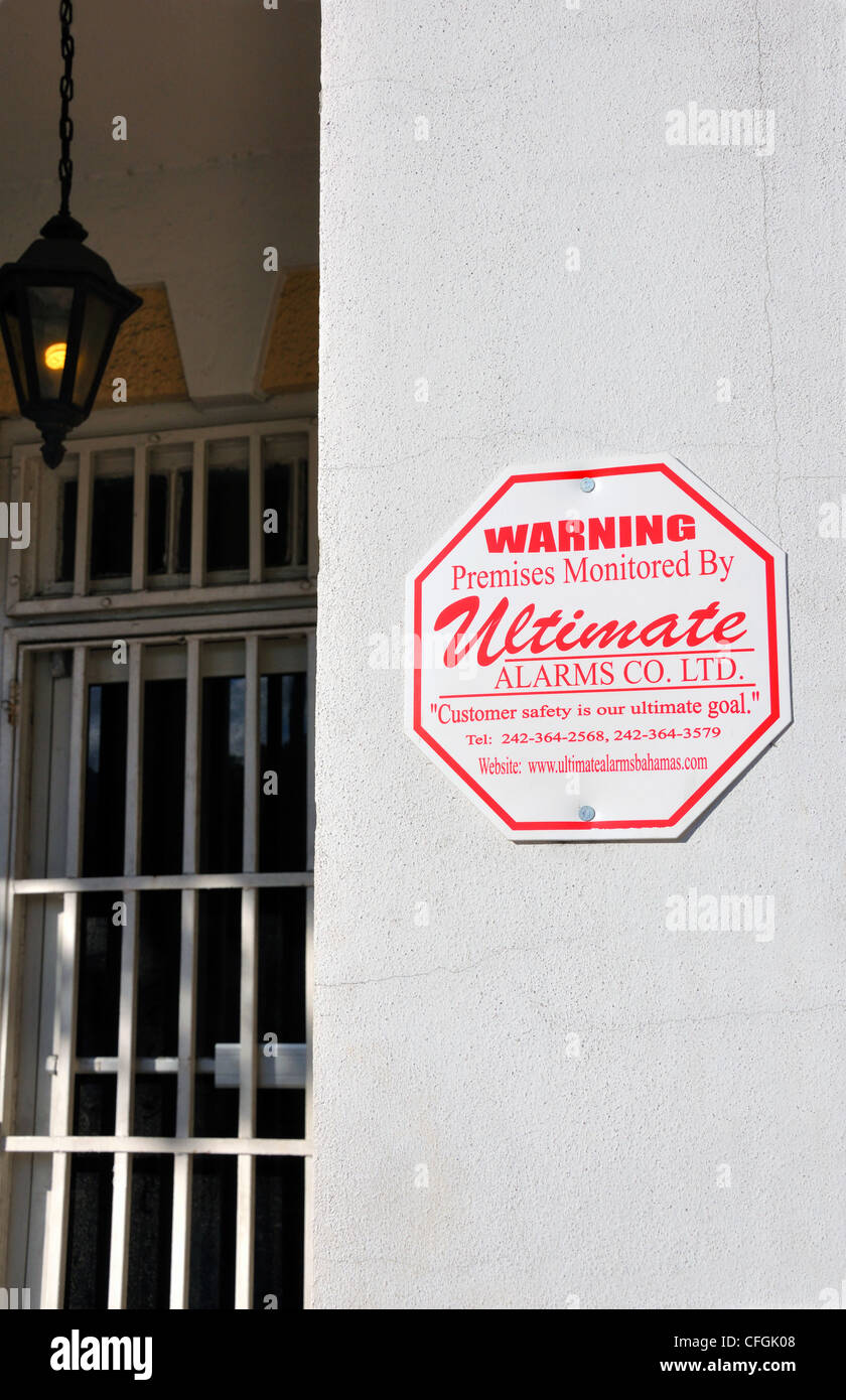 Monitored premises alarm warning sign, Nassau, Bahamas Stock Photo - Alamy
