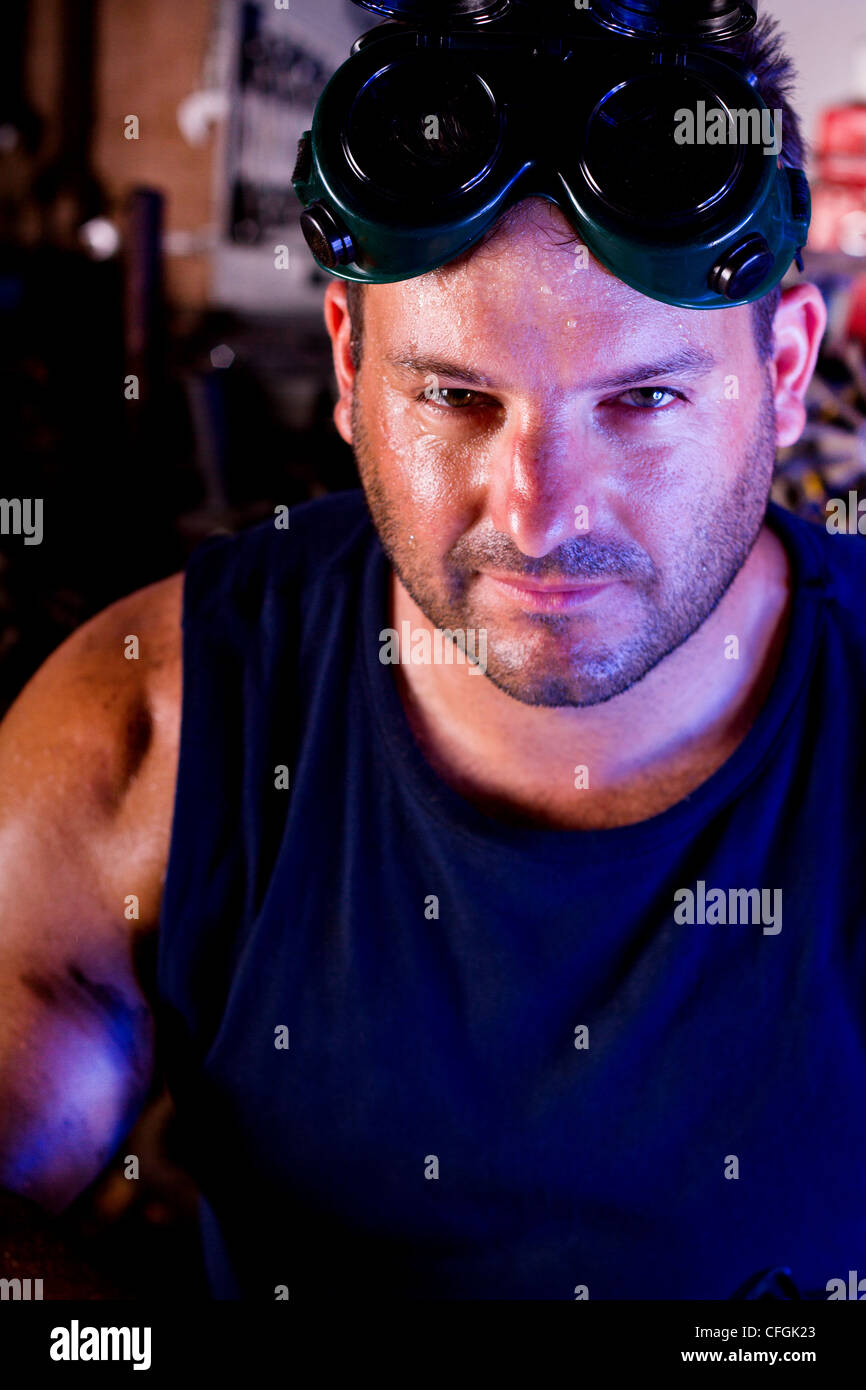 View of a garage mechanic man face with protection goggles Stock Photo ...