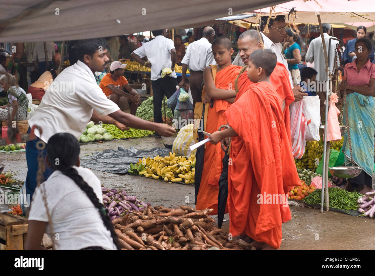 Buddhist monks collecting vegetables in market Stock Photo - Alamy