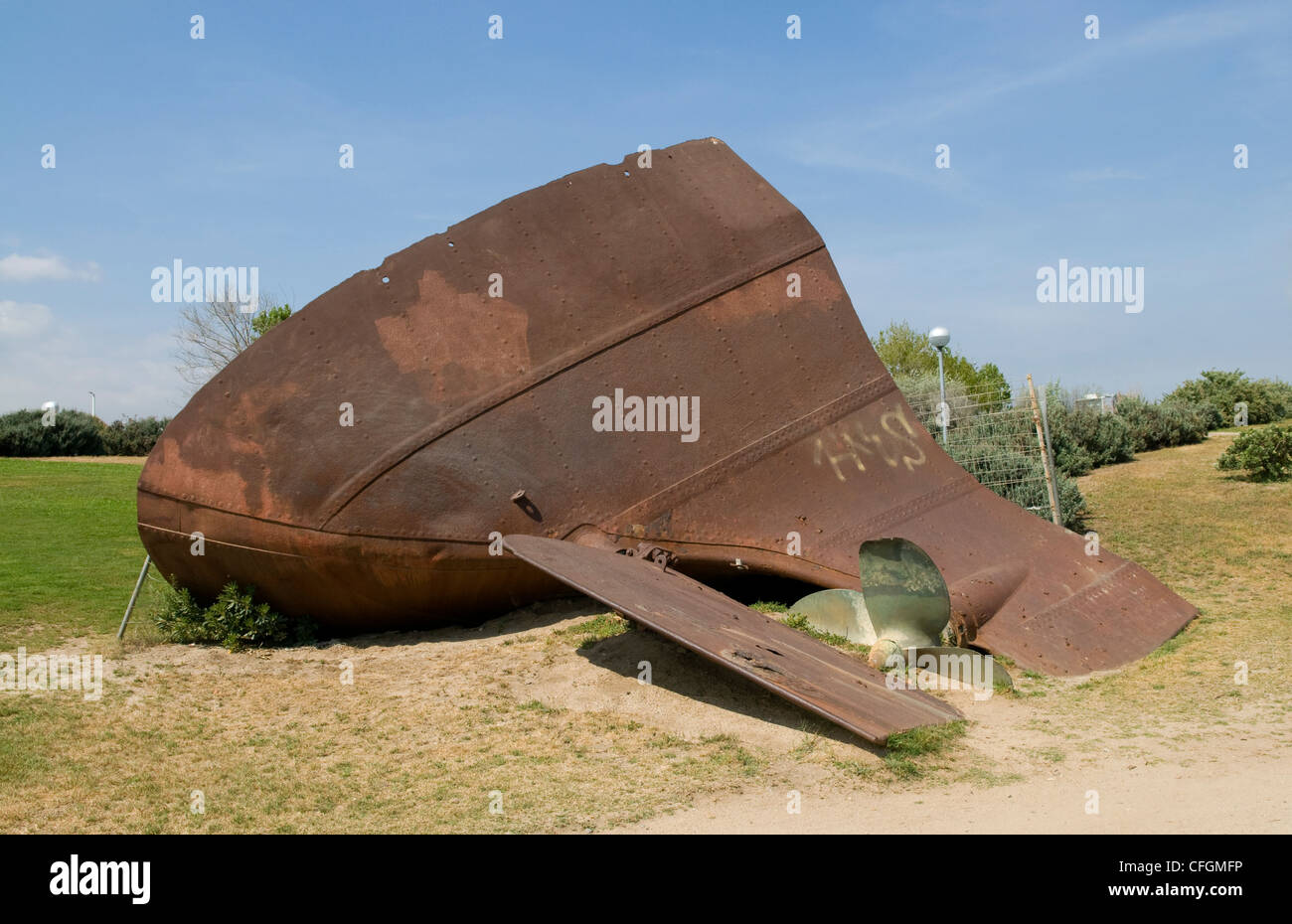 Part of a rusty shipwreck displayed on beach in Barcelona Stock Photo ...