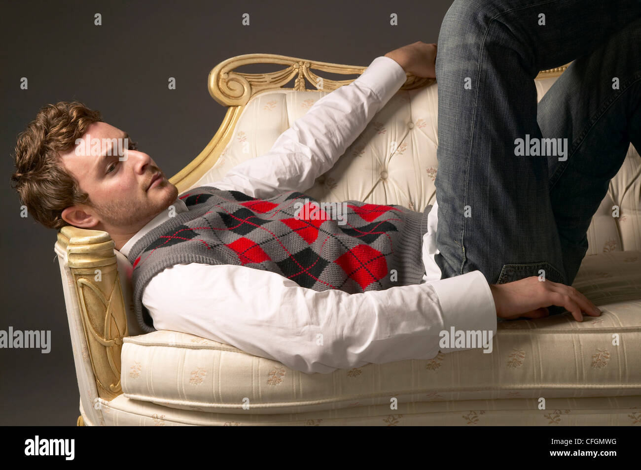 Man lying on Couch, Toronto, Ontario Stock Photo - Alamy