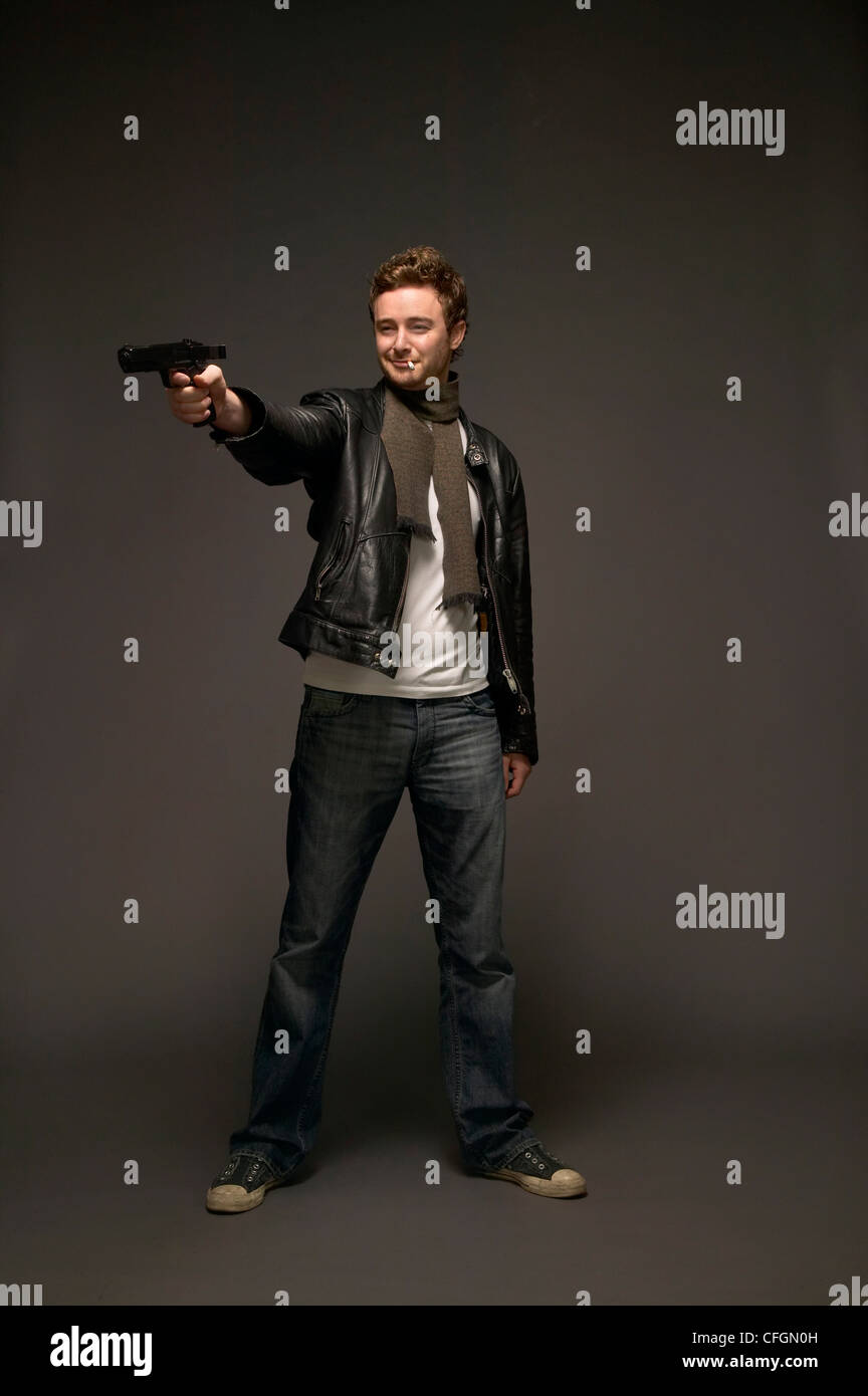 Man Holding a Gun Smiling, Toronto, Ontario Stock Photo - Alamy