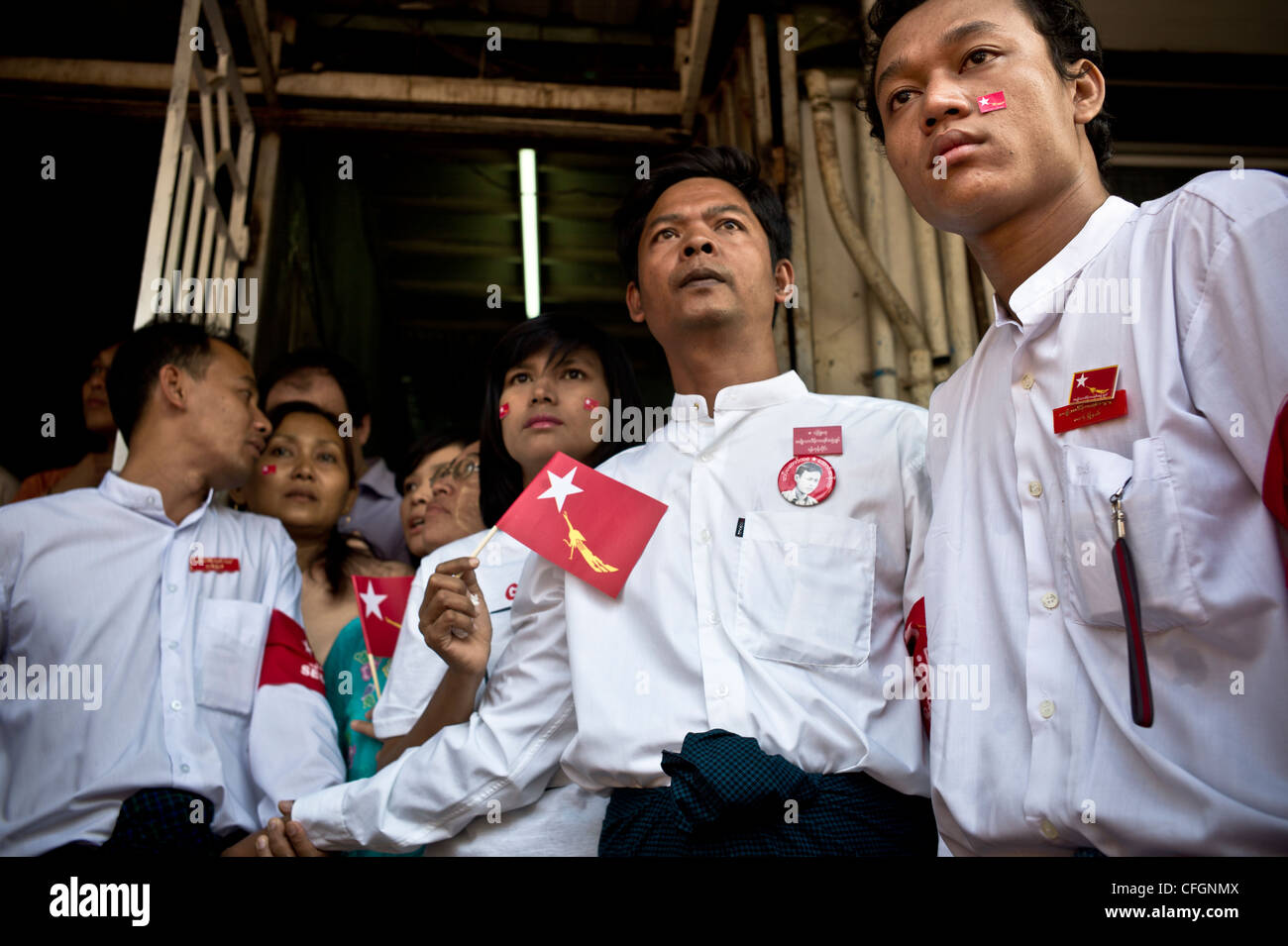 Security guards from the National League for Democracy wait for Aung ...