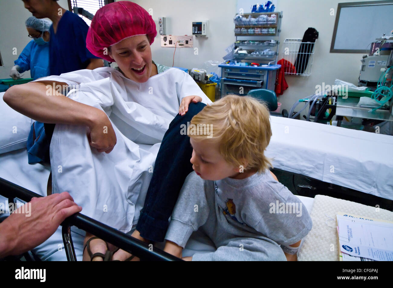 A mother accompanies her son in an operating room for ear surgery Stock ...