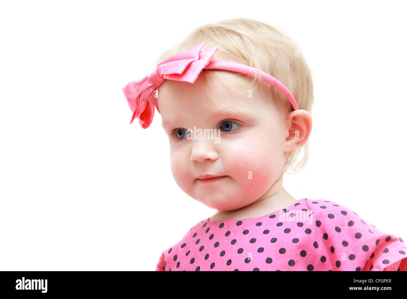 Baby with pink bow Stock Photo - Alamy