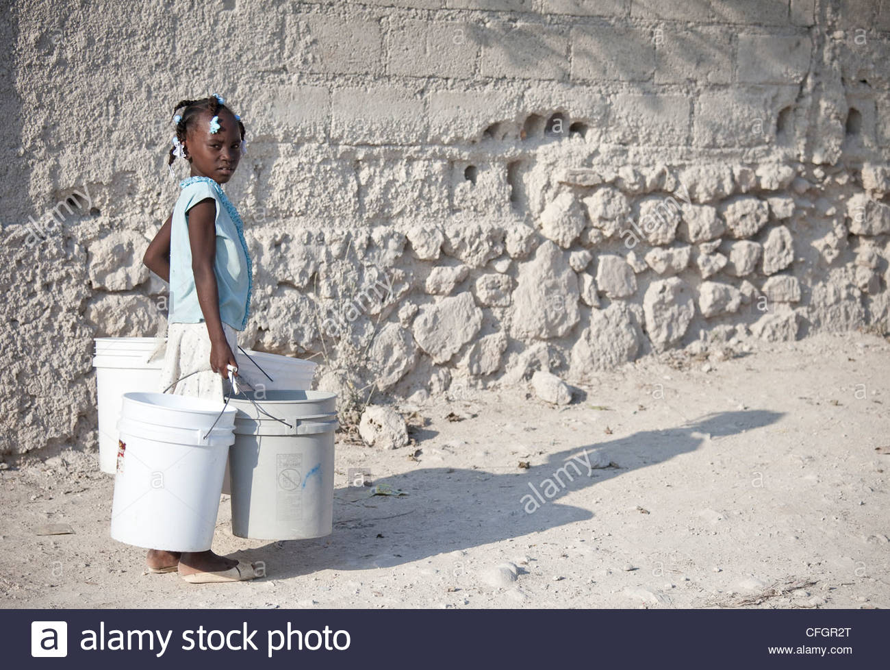 Carrying Water With Buckets Stock Photos & Carrying Water With Buckets ...