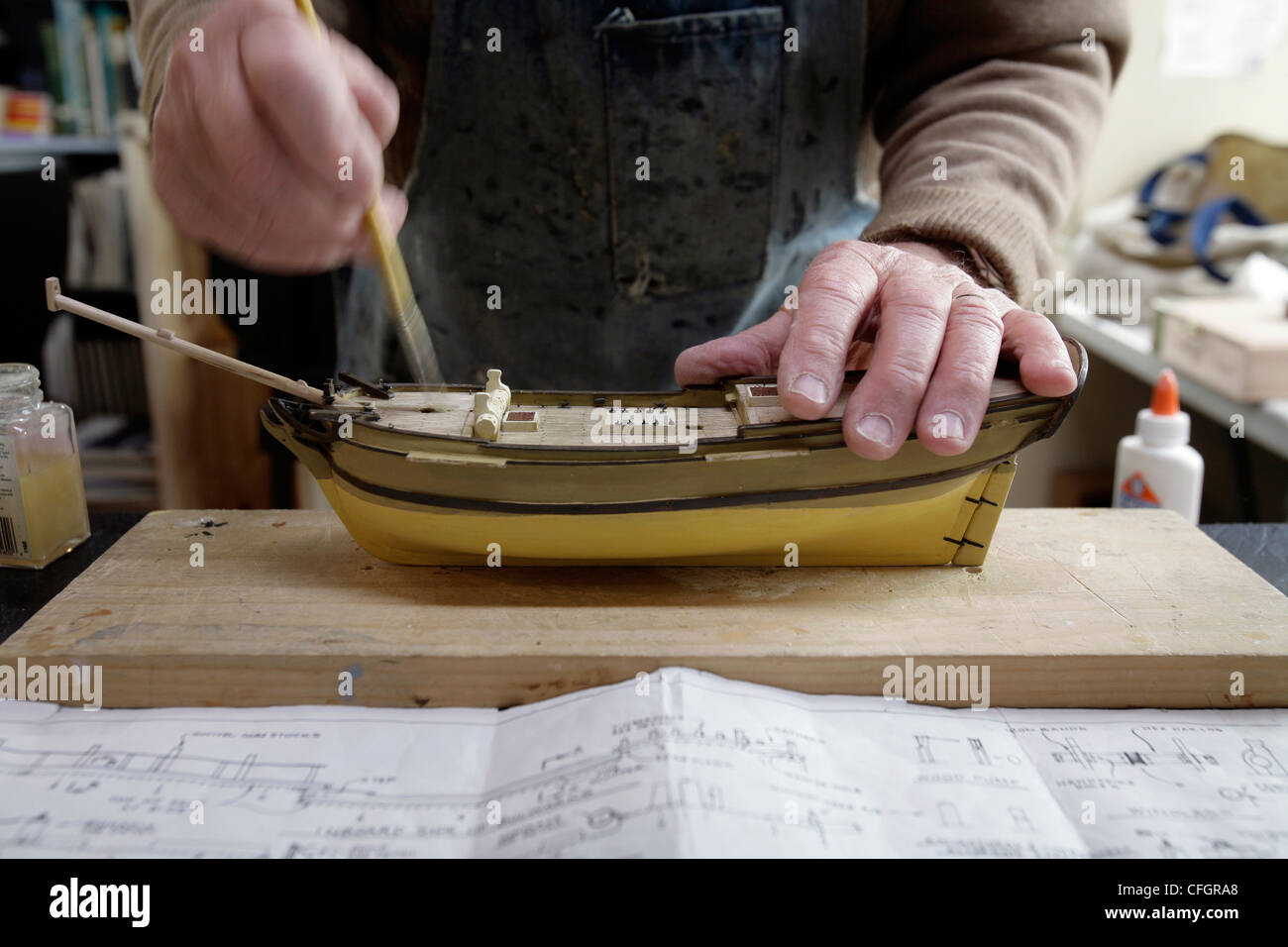 A man working on a sailing ship model Stock Photo - Alamy