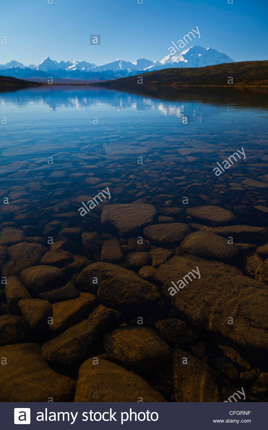 The Alaska Range reflected in a still pond filled with stones Stock ...