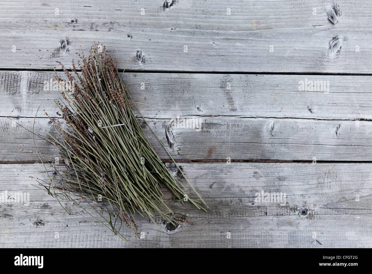 Lavender Stalks on Bleached Wood Stock Photo - Alamy