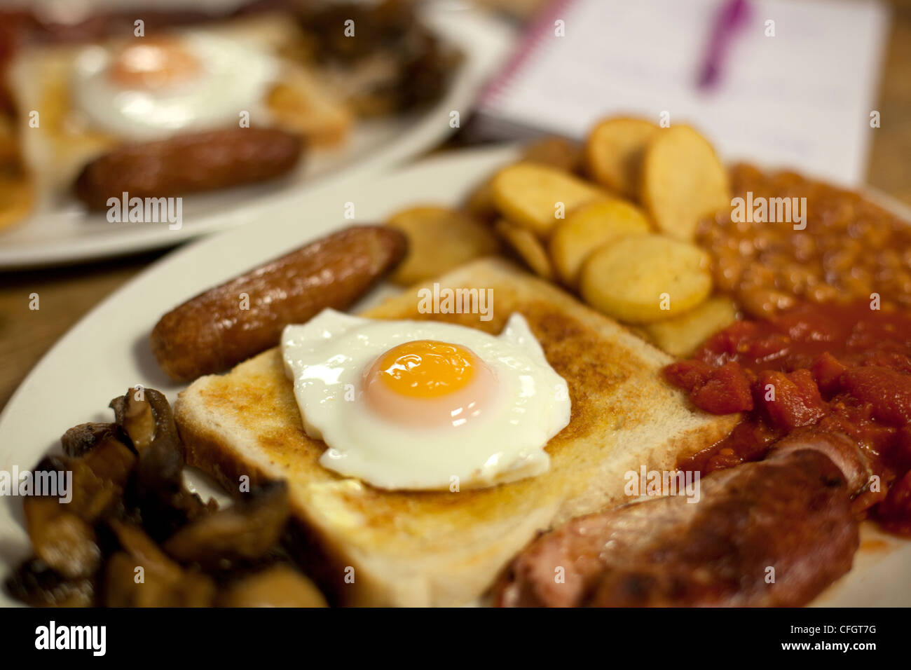 Full English breakfast meal in a cafe with notepad and pen Stock Photo ...