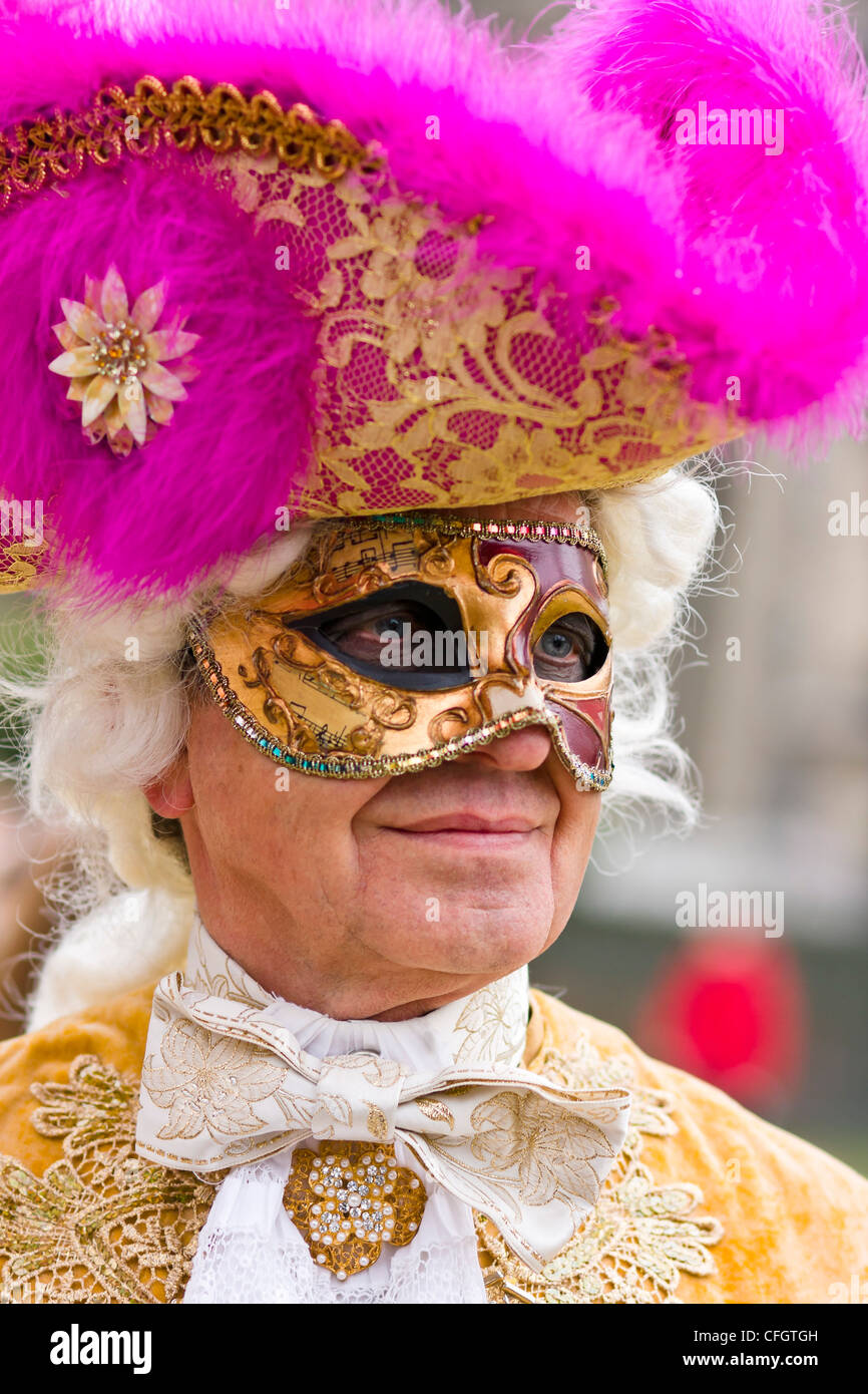 Venetian carnival mask costume parade Stock Photo - Alamy