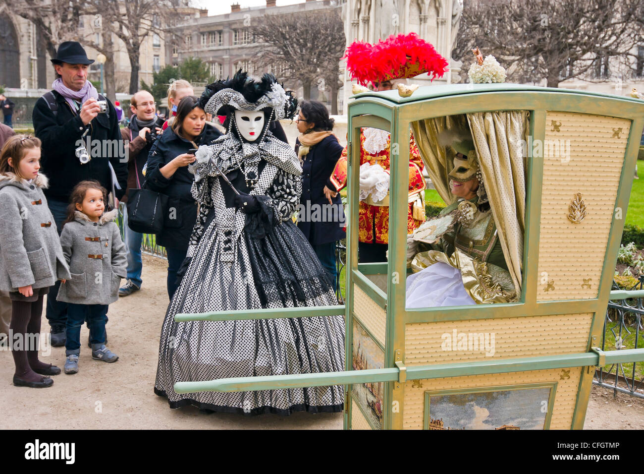 Venetian carnival mask costume parade Stock Photo - Alamy