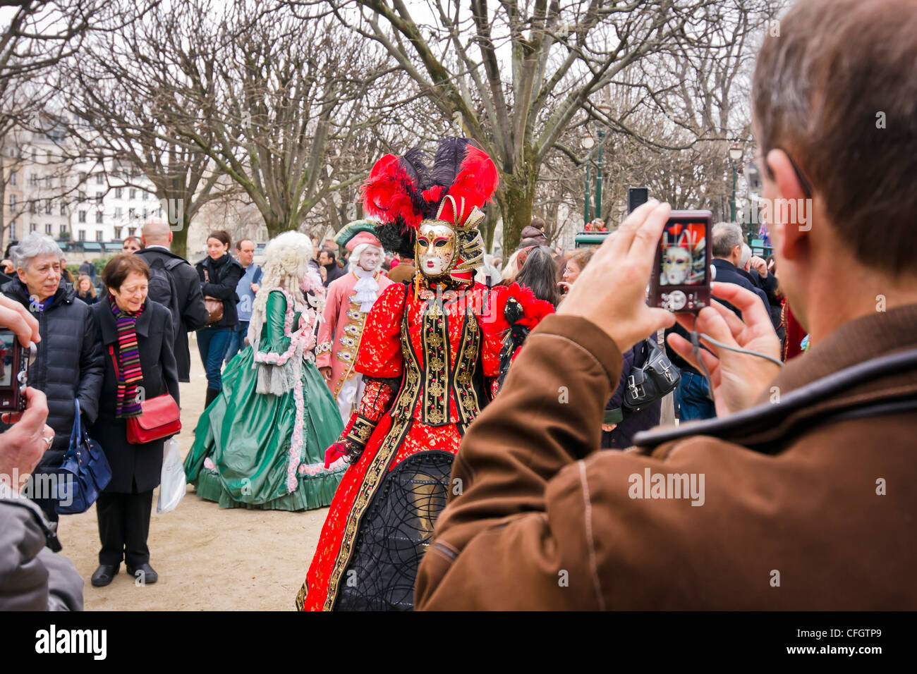 Venetian carnival mask costume parade Stock Photo - Alamy