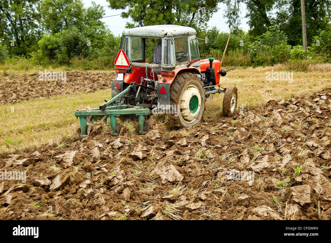 Old tractor ploughing field hi-res stock photography and images - Alamy