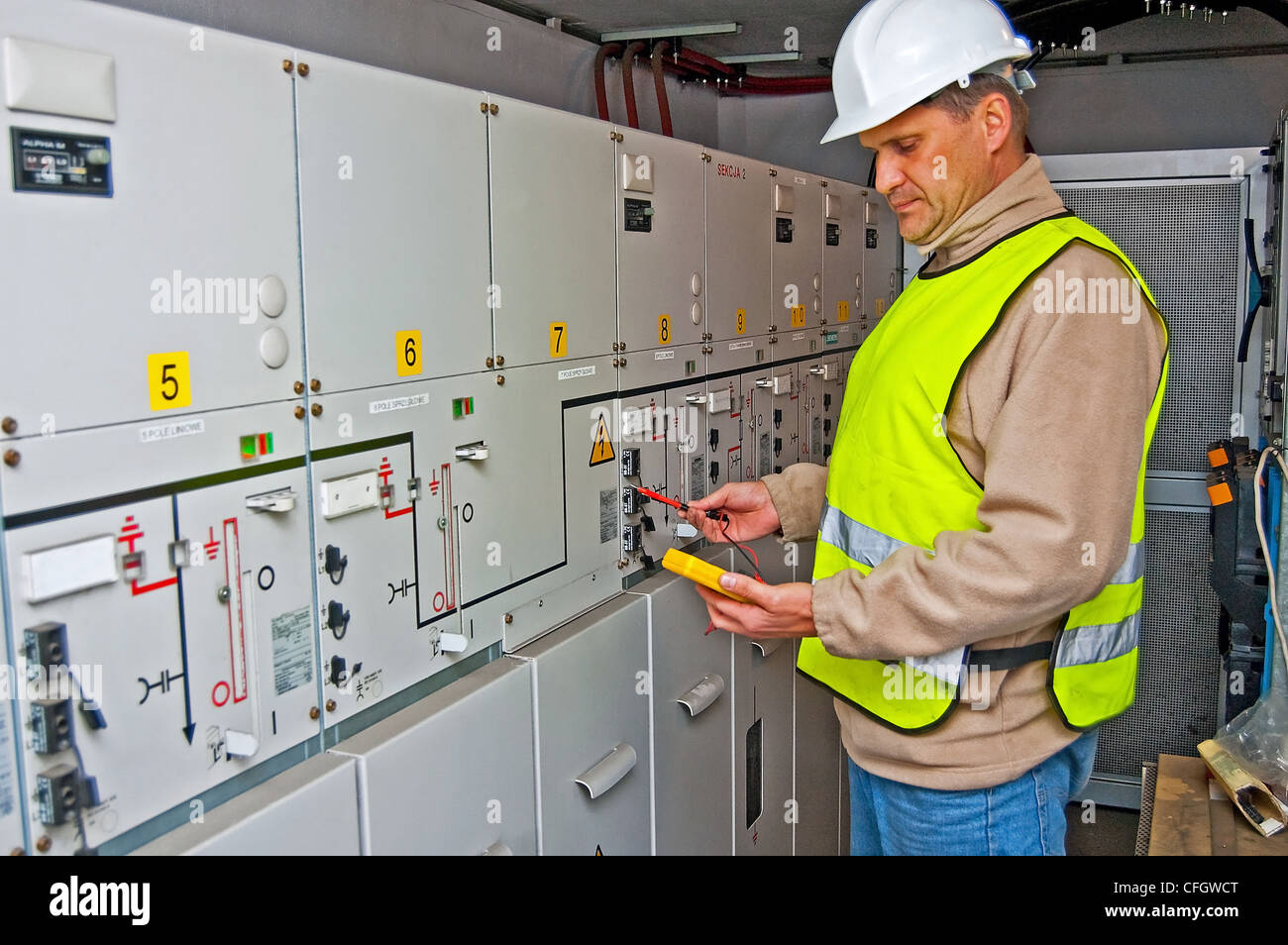 Electrician in studying the current-voltage switchgear and state ...