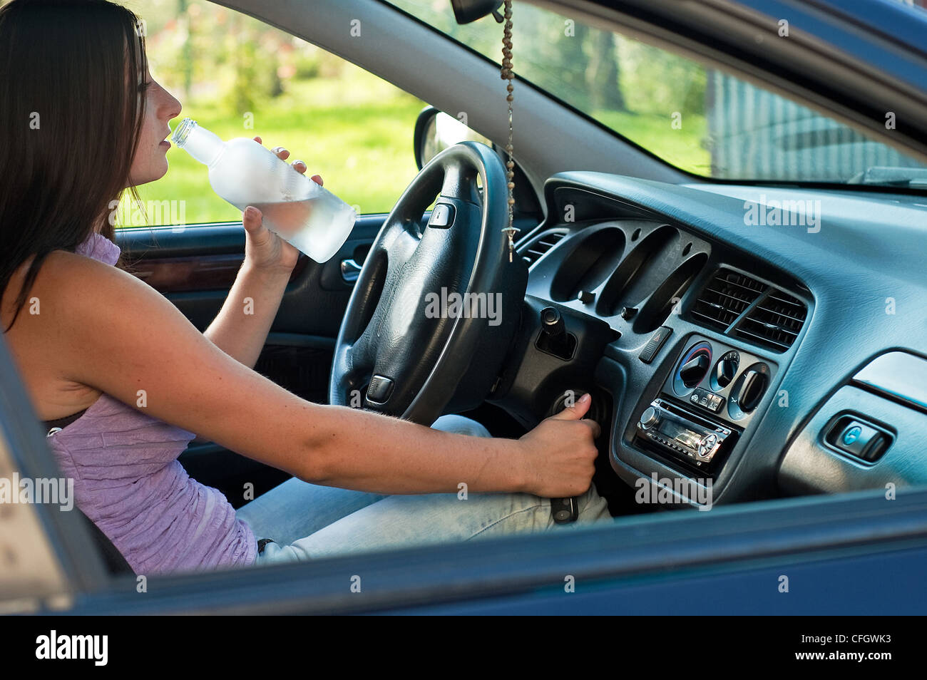 Drunk woman driving car vodka hi-res stock photography and images - Alamy