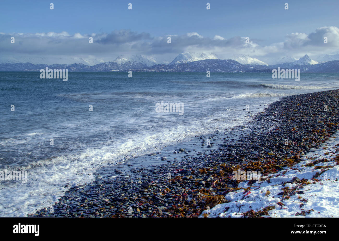 Alaskan beach off the Kachemak bay in winter with the Kenai mountains ...