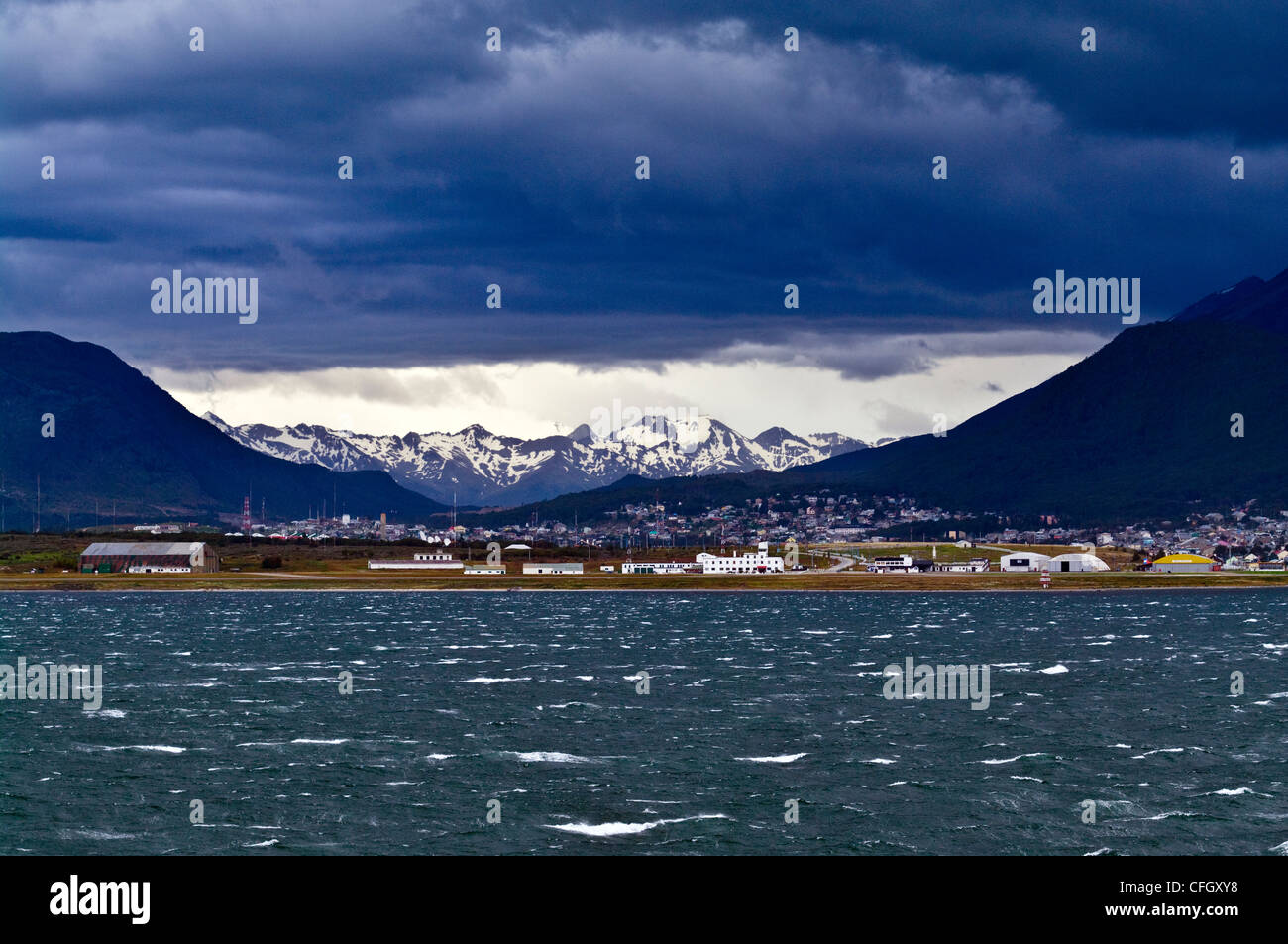 Strong wind whips whitecaps across the ocean surface beneath a storm ...