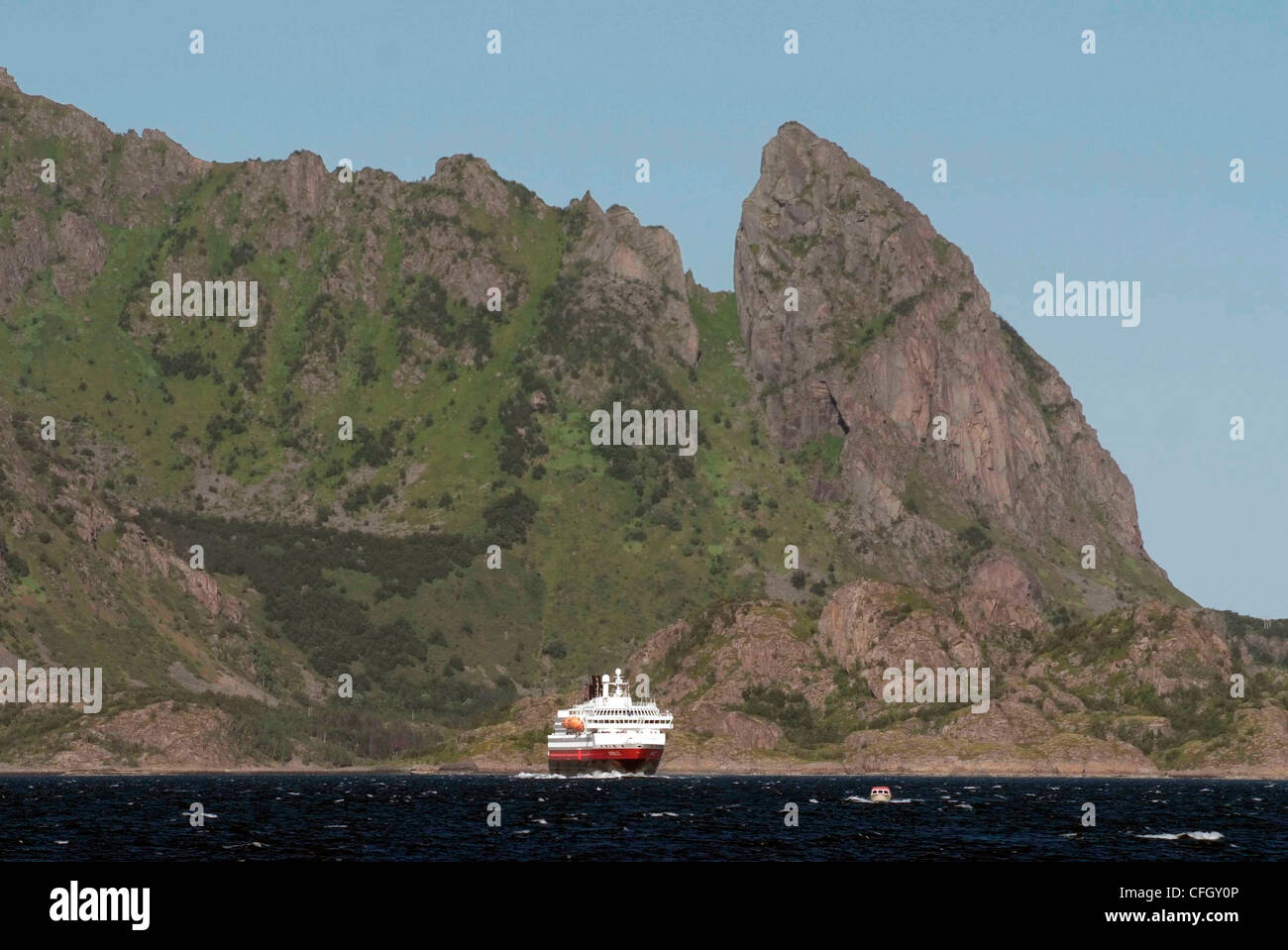 NORWAY LOFOTEN ISLANDS .Hurtigruten ship MV Nordlys cruises against the ...