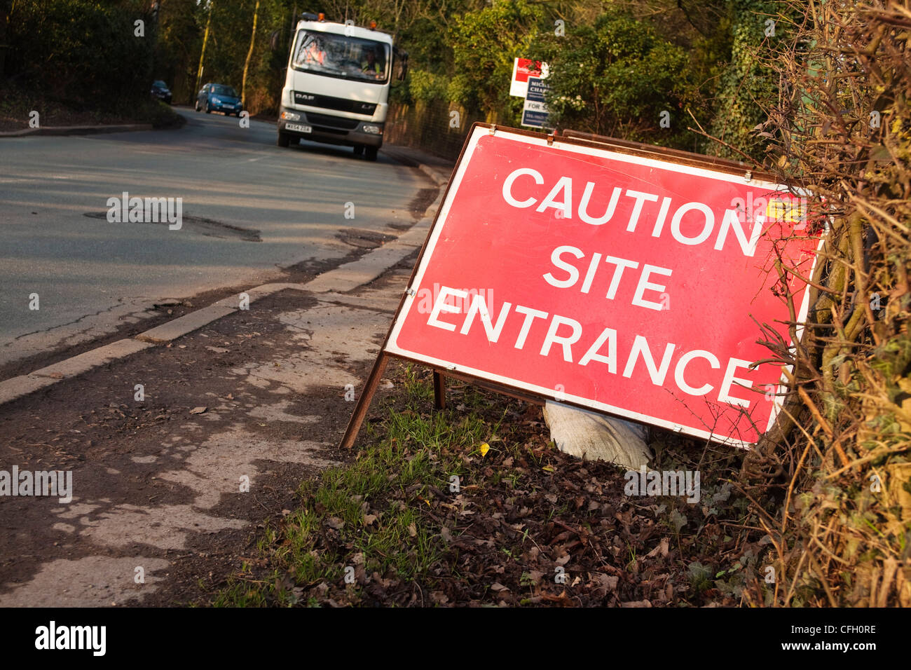 A 'caution site entrance' warning sign for motorists Stock Photo - Alamy
