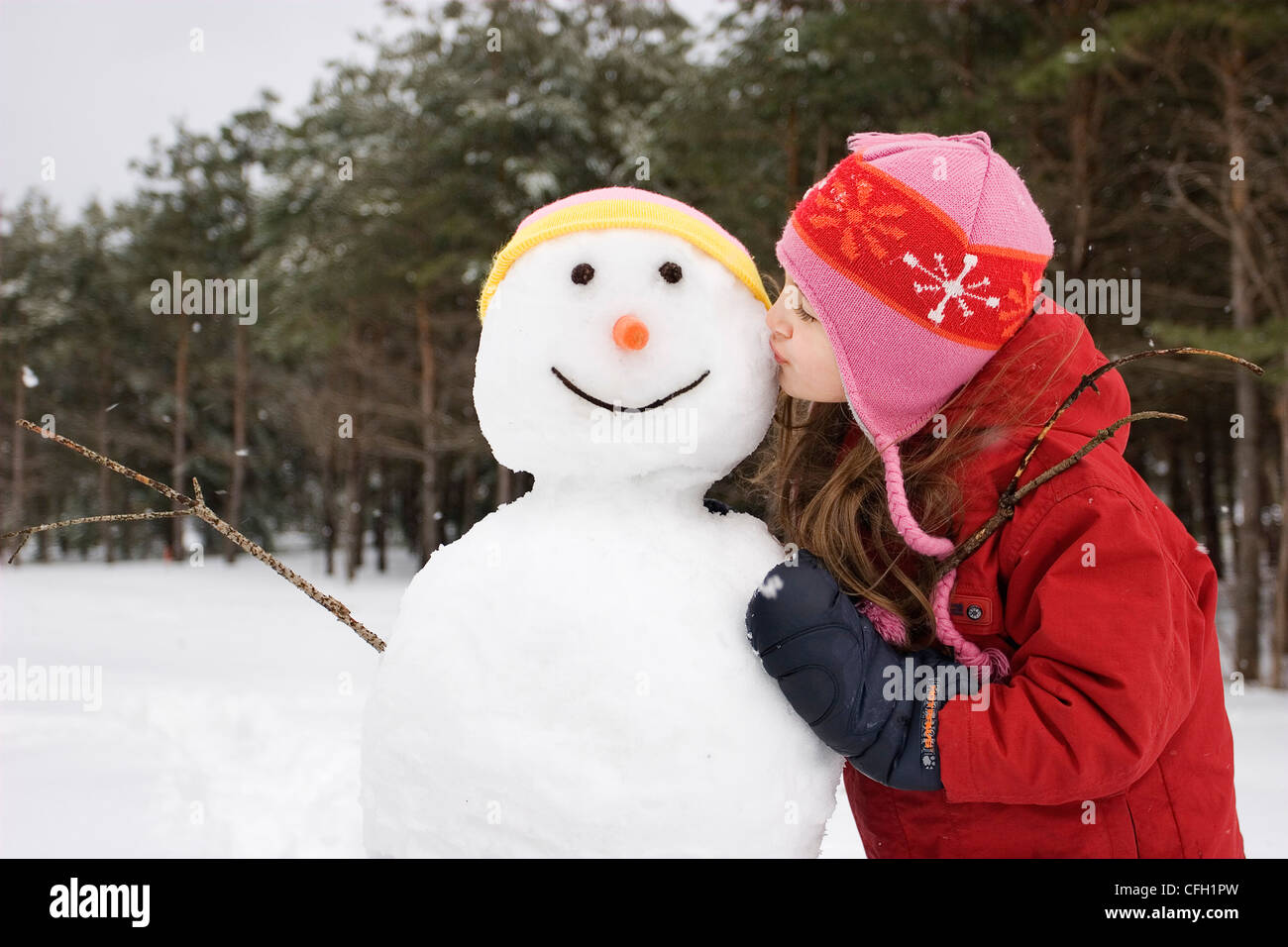 Young Girl Kissing Snowman, Toronto, Ontario Stock Photo - Alamy