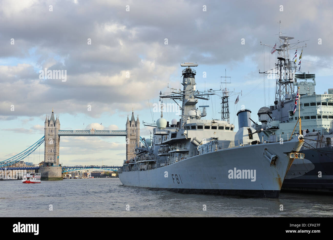 HMS Sutherland moored by HMS Belfast October 2011 River Thames London ...