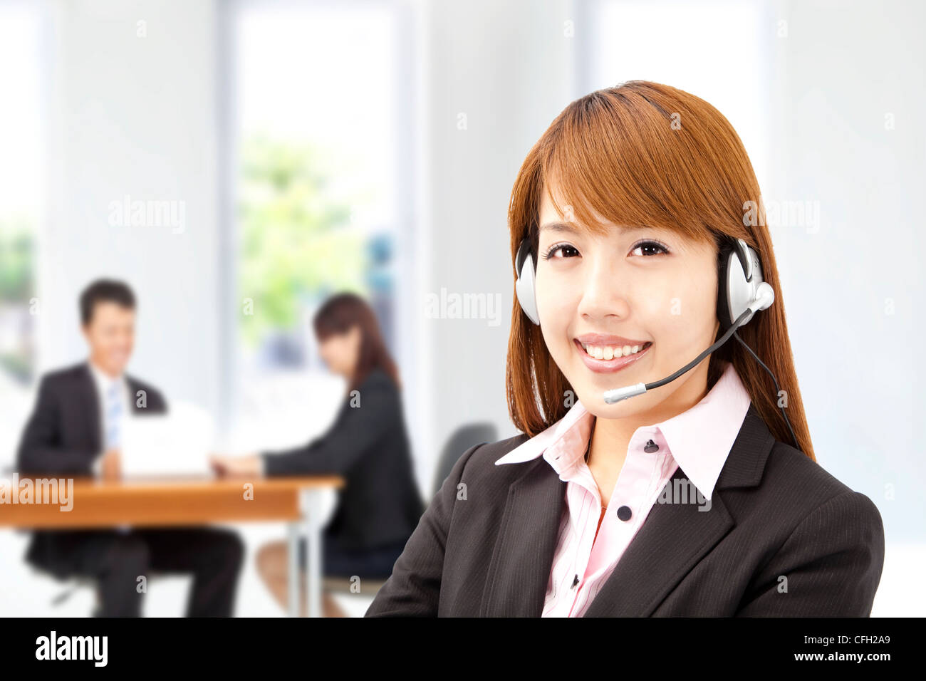 Smiling asian businesswoman customer service on the phone Stock Photo ...
