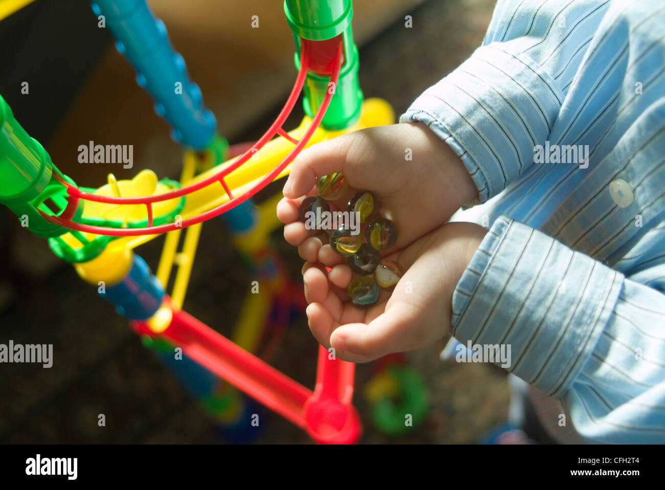 Hand holding marbles hi-res stock photography and images - Alamy