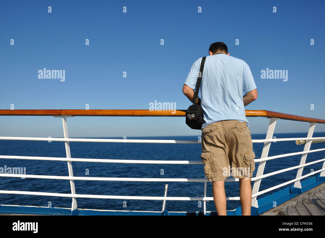 Man on cruise ship Stock Photo - Alamy