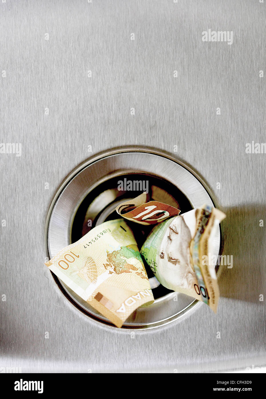 Money waste drain hi-res stock photography and images - Alamy