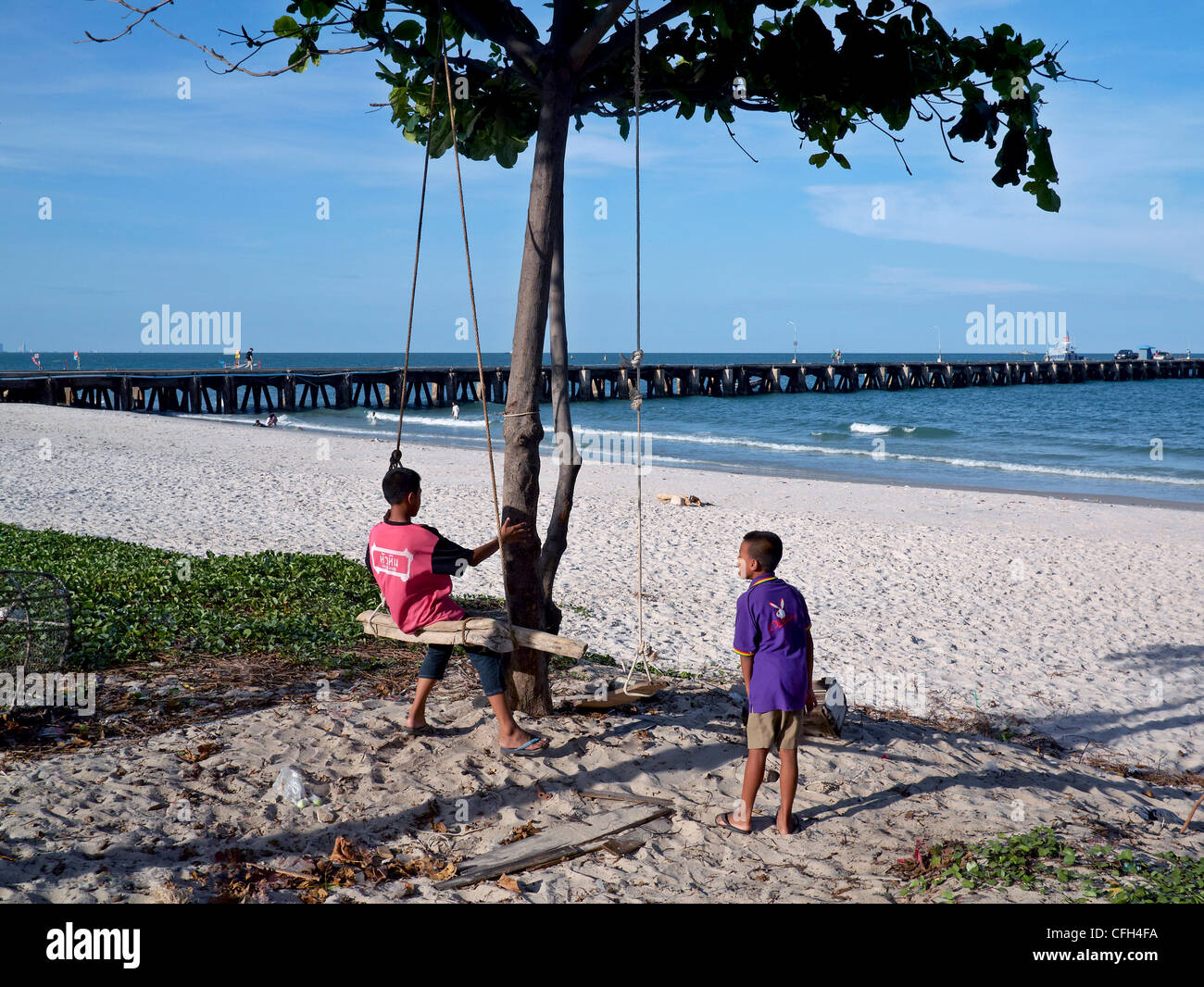 Children Playing On Tree Swing High Resolution Stock Photography and ...