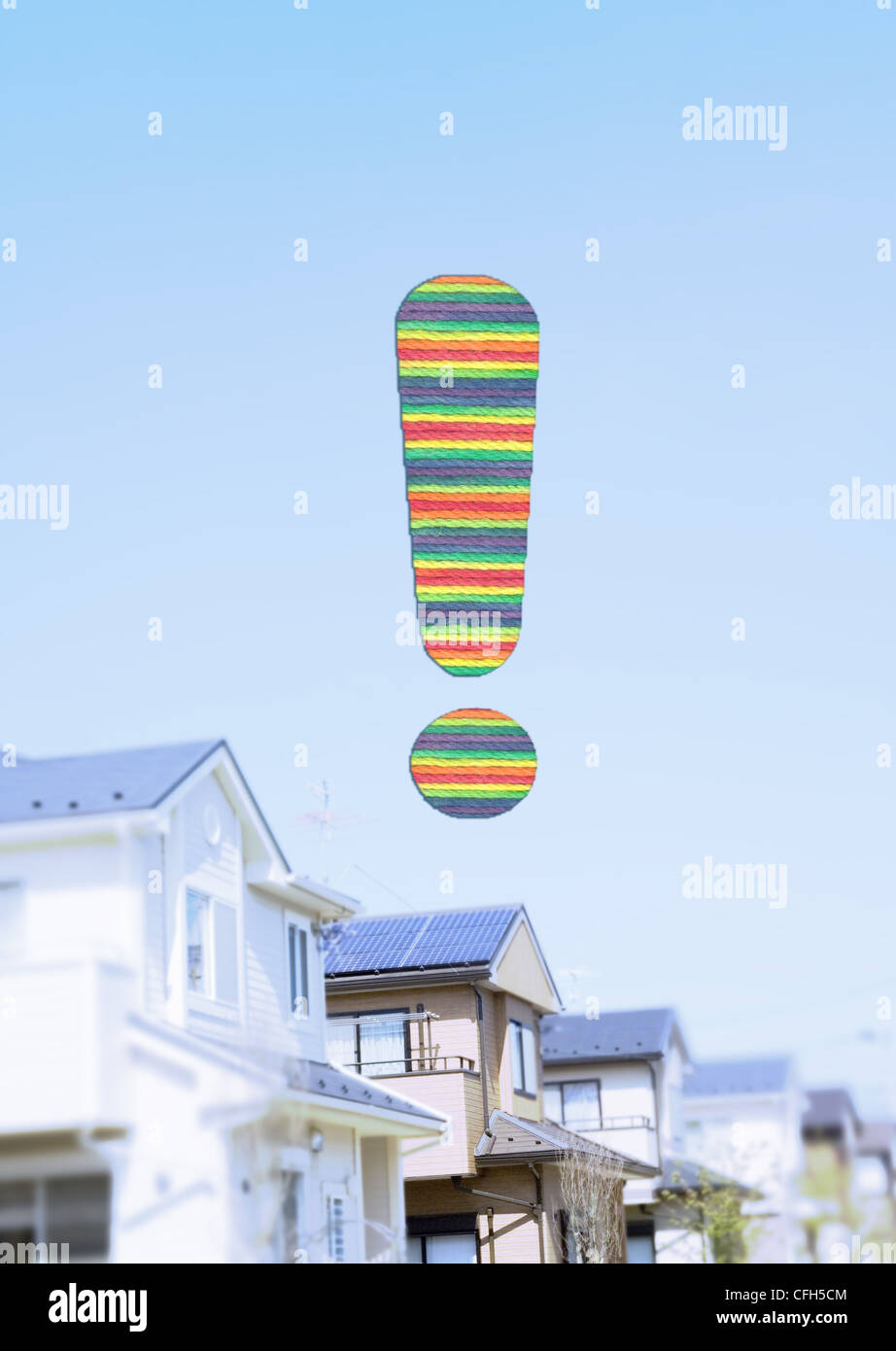 Exclamation mark floating above residential area Stock Photo - Alamy